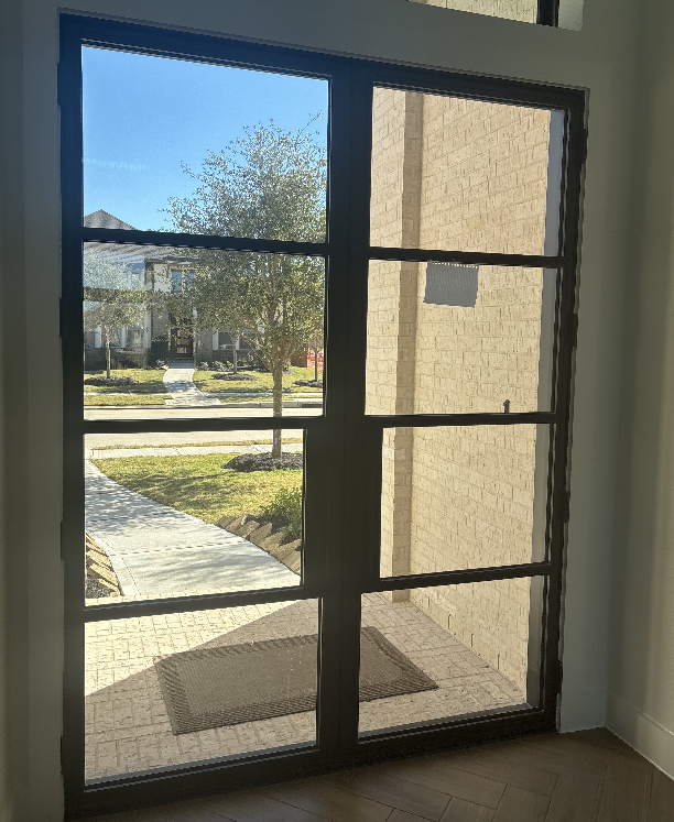 8 panel windows on front door and 9 panel windows for living